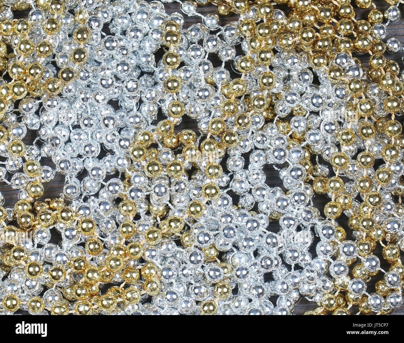 Gold and silver shiny pearls pile background Stock Photo - Alamy