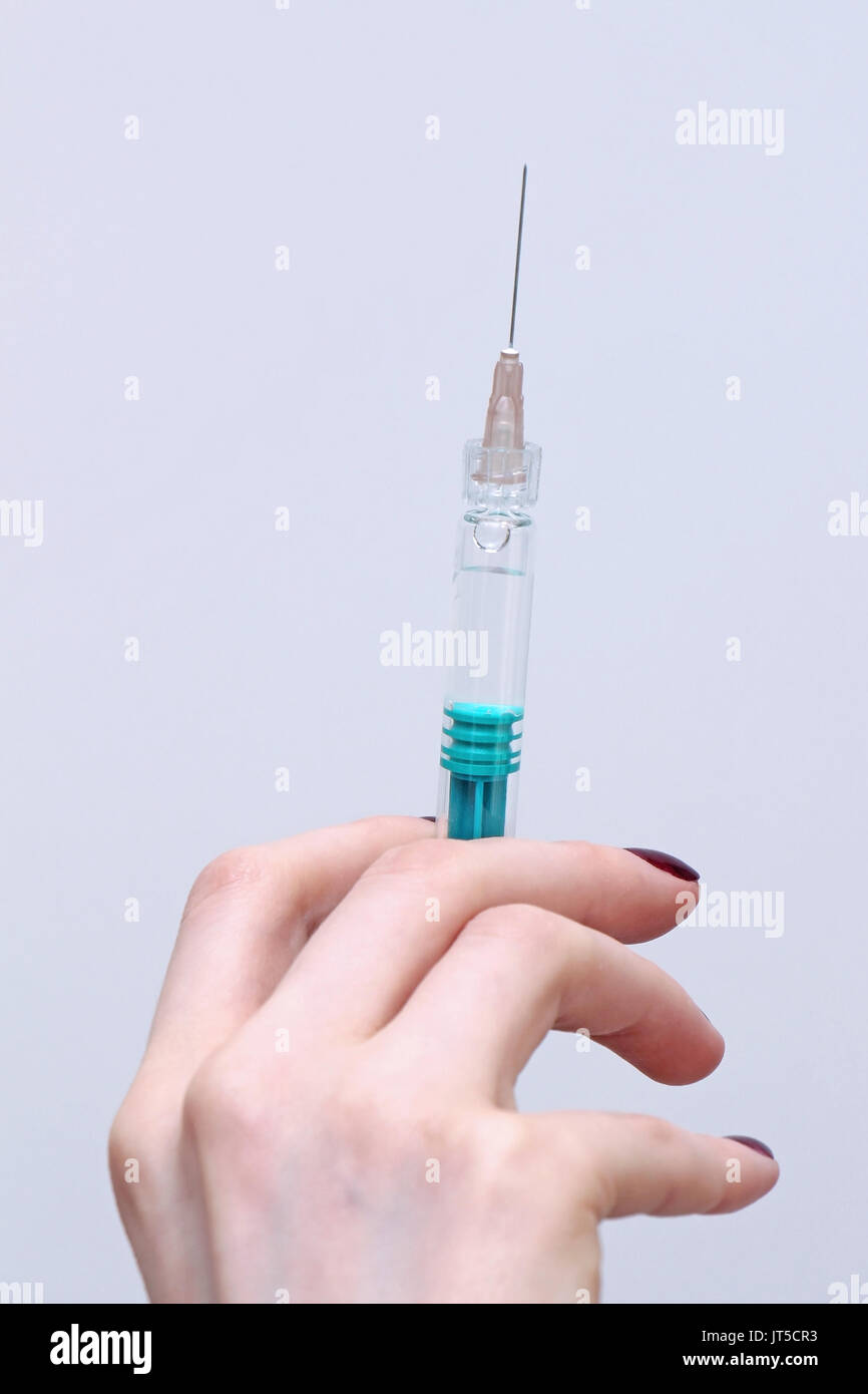 Hand holding needle hi-res stock photography and images - Alamy