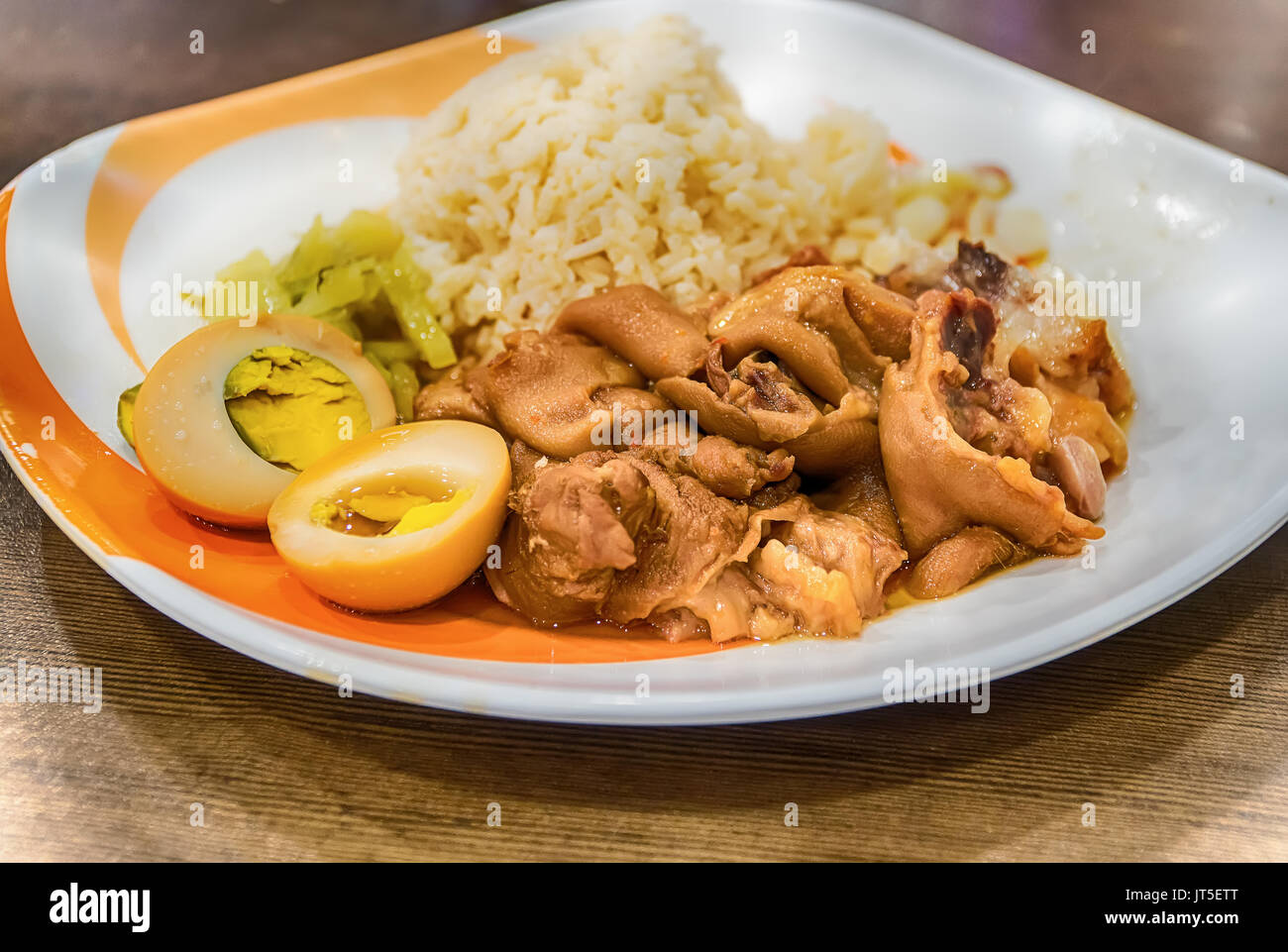 Stewed pork leg over rice Stock Photo - Alamy