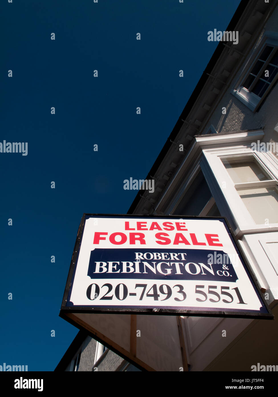 Estate agent advertising sign, retail unit lease for sale, over vacant ...