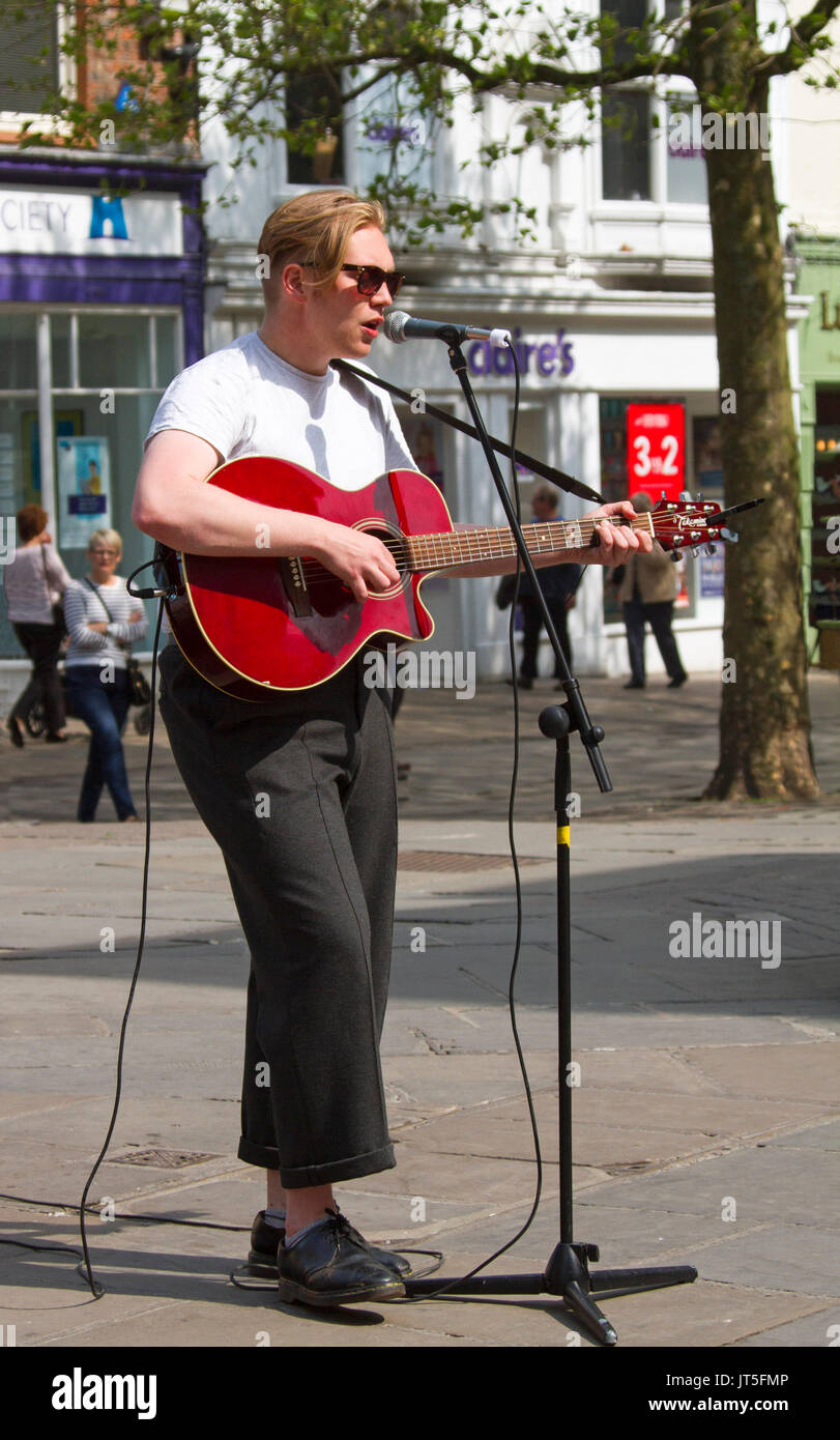 Man, lead singer and guitarist with group, The Hyde Family, playing a ...