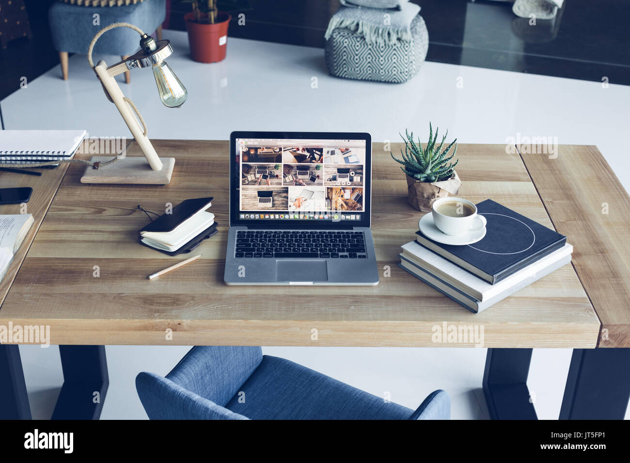 Open laptop, books and cup of coffee at modern workplace Stock Photo ...