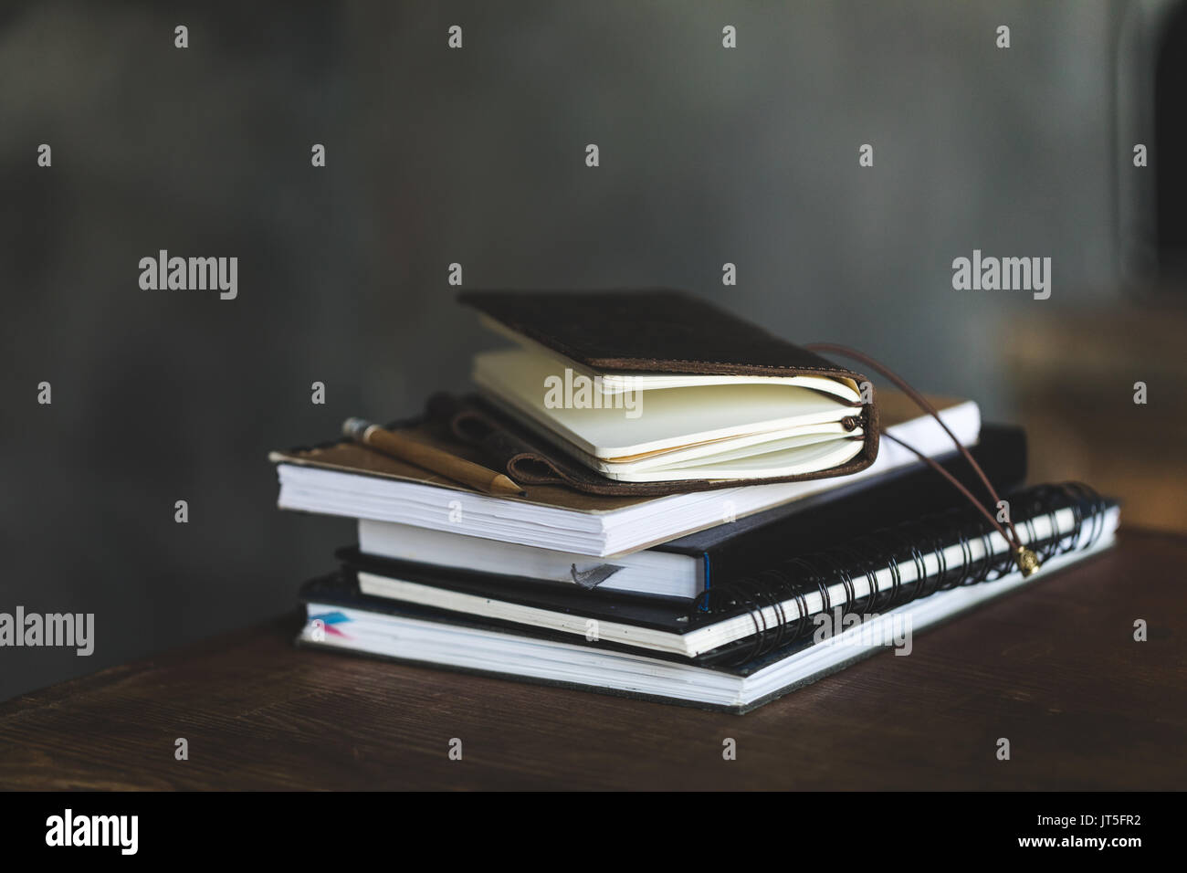 Stacked notebooks hi-res stock photography and images - Alamy