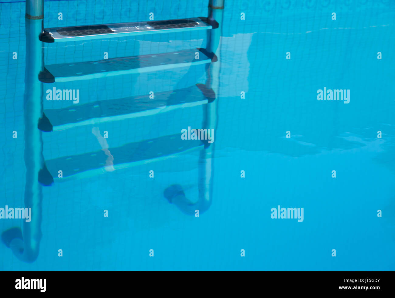 Stainless steel steps under water at a swimming pool Stock Photo - Alamy