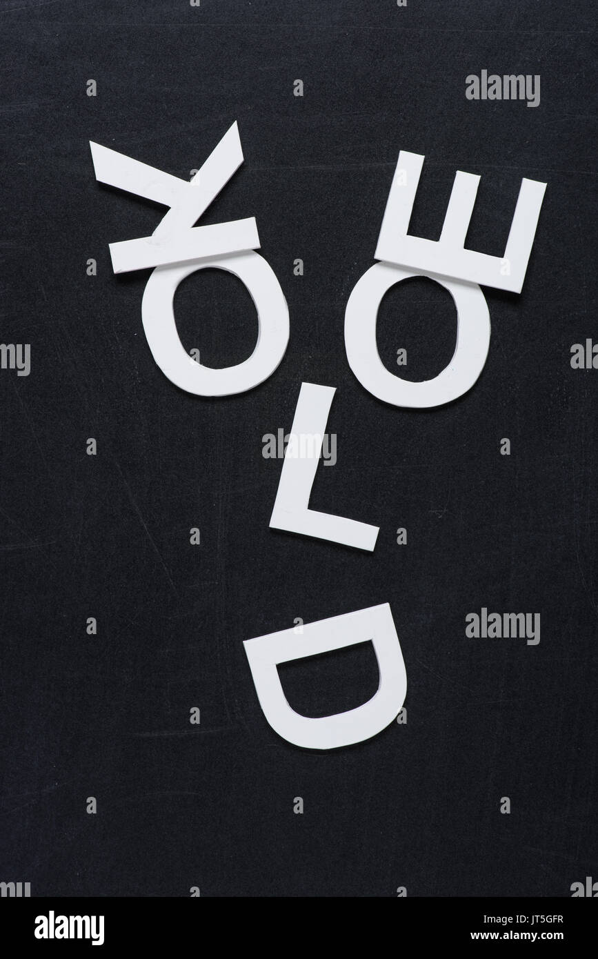 white paper letters in form of face on black school chalkboard Stock ...