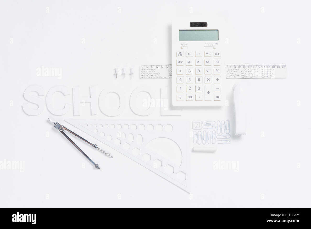 calculator with rulers and stapler with compasses mock-up isolated on ...