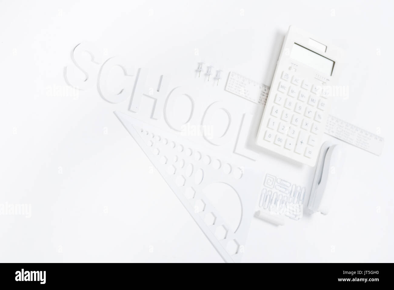 calculator with rulers and stapler with compasses mock-up isolated on ...