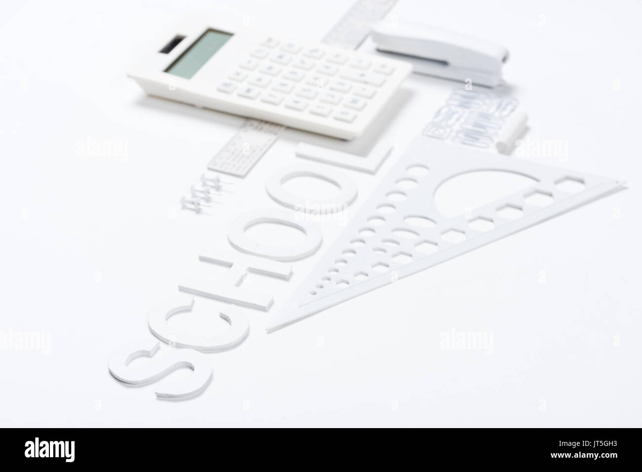 calculator with rulers and stapler with compasses mock-up isolated on ...