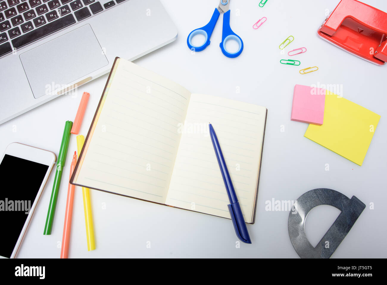 empty copybook and different school supplies isolated on white Stock ...