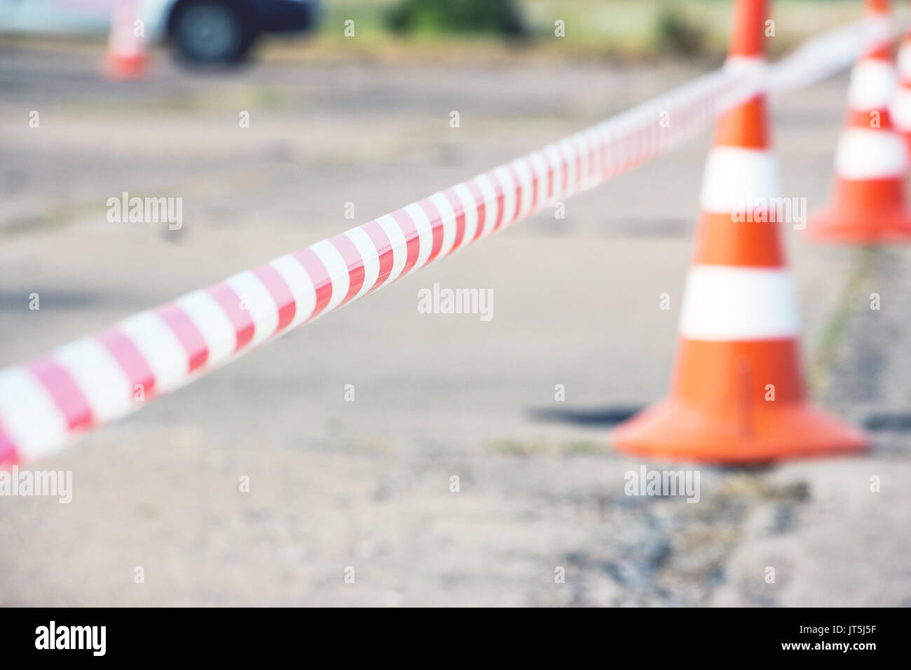 Fencing tape and road cone Stock Photo - Alamy