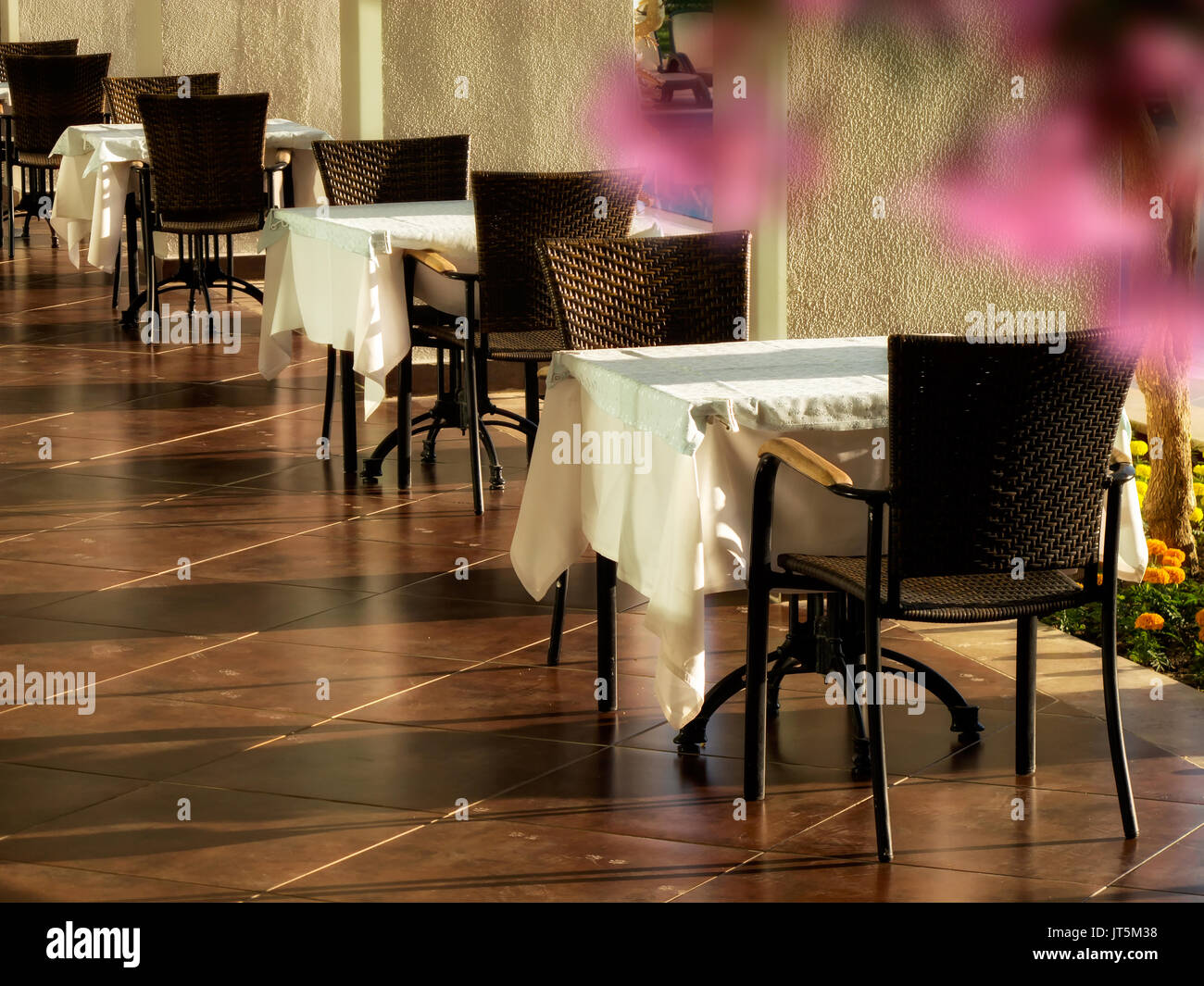 close up shot of outdoor empty restaurant table and chairs Stock Photo ...