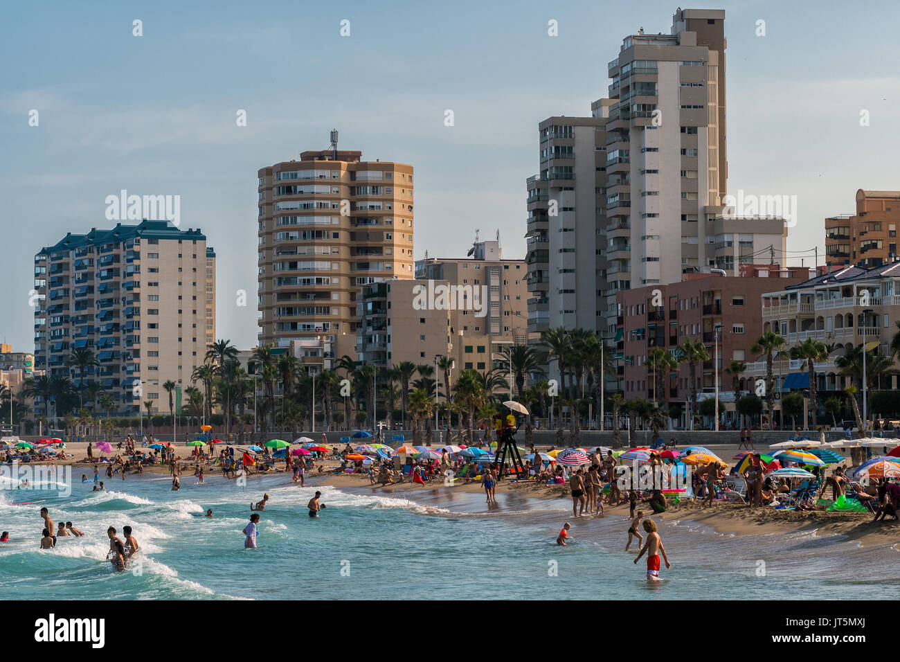 Hundreds of bathers enjoy summer in crowded El Campello beach, Alicante ...