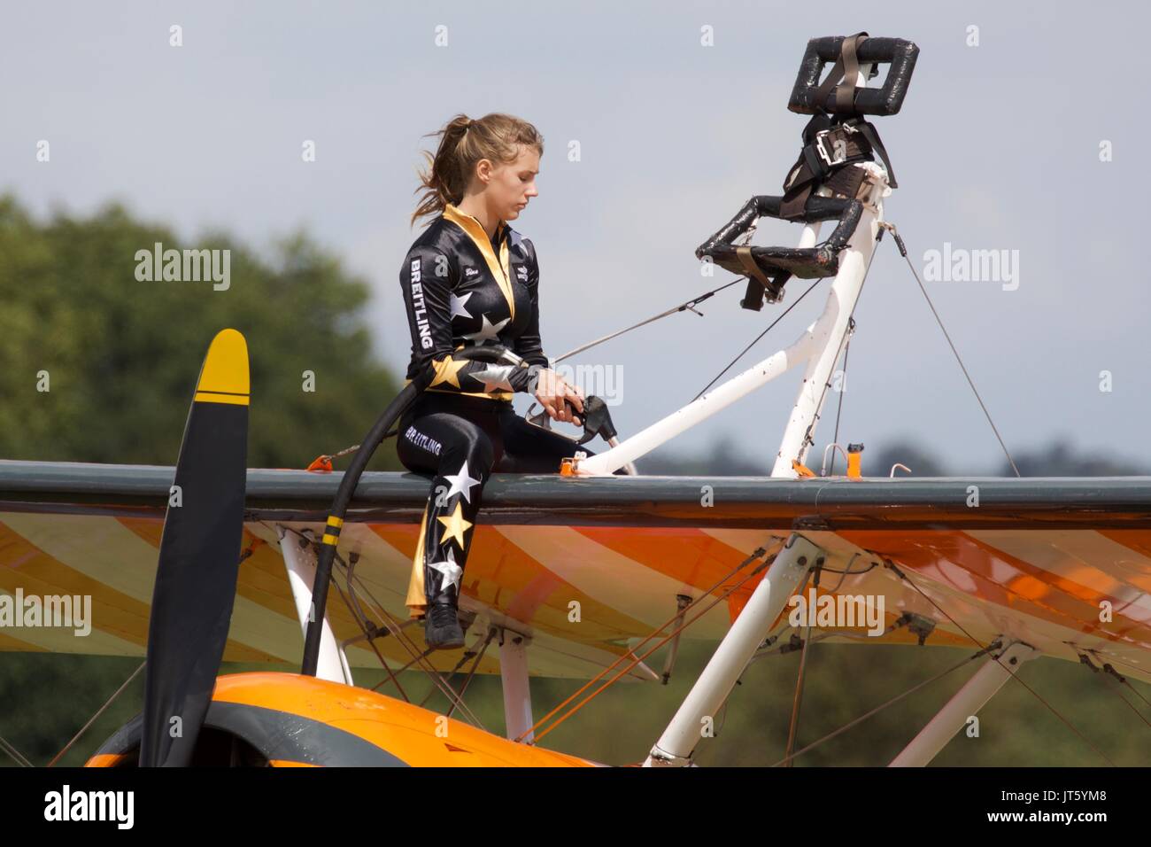 Breitling Wingwalker Katie Hobbs topping up the Boeing Stearman biplane ...