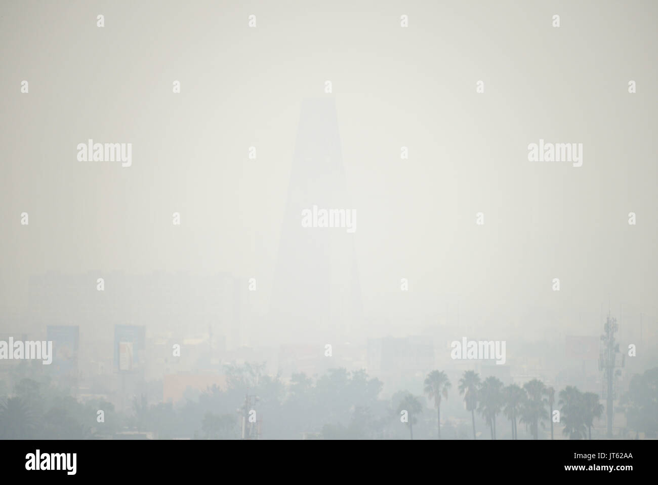 limited visibility on a smoggy day in Mexico City Stock Photo - Alamy