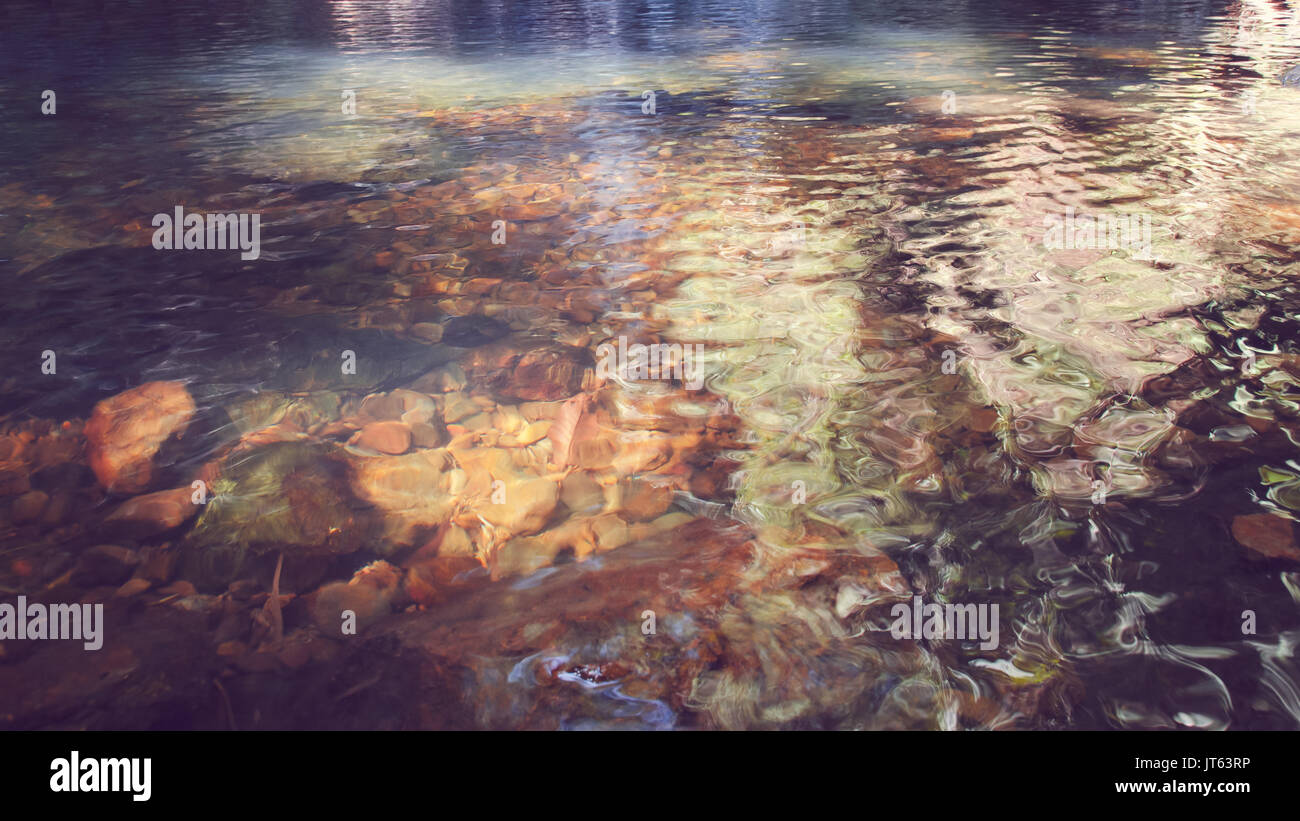 Clear river water with rocks, brown background & nature lighting Stock ...
