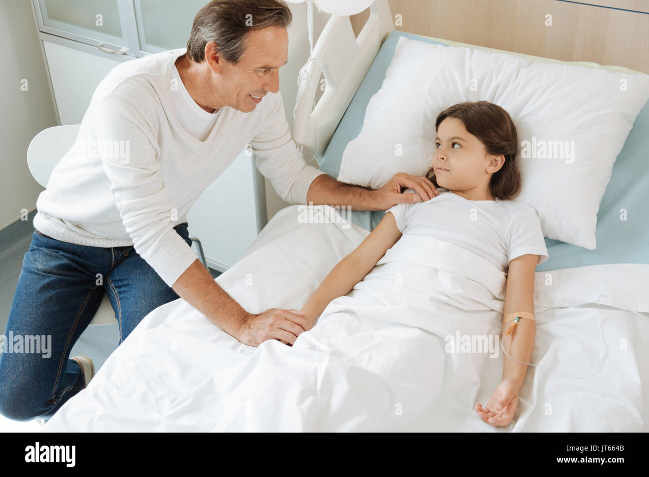Happy nice father looking at his daughter Stock Photo - Alamy
