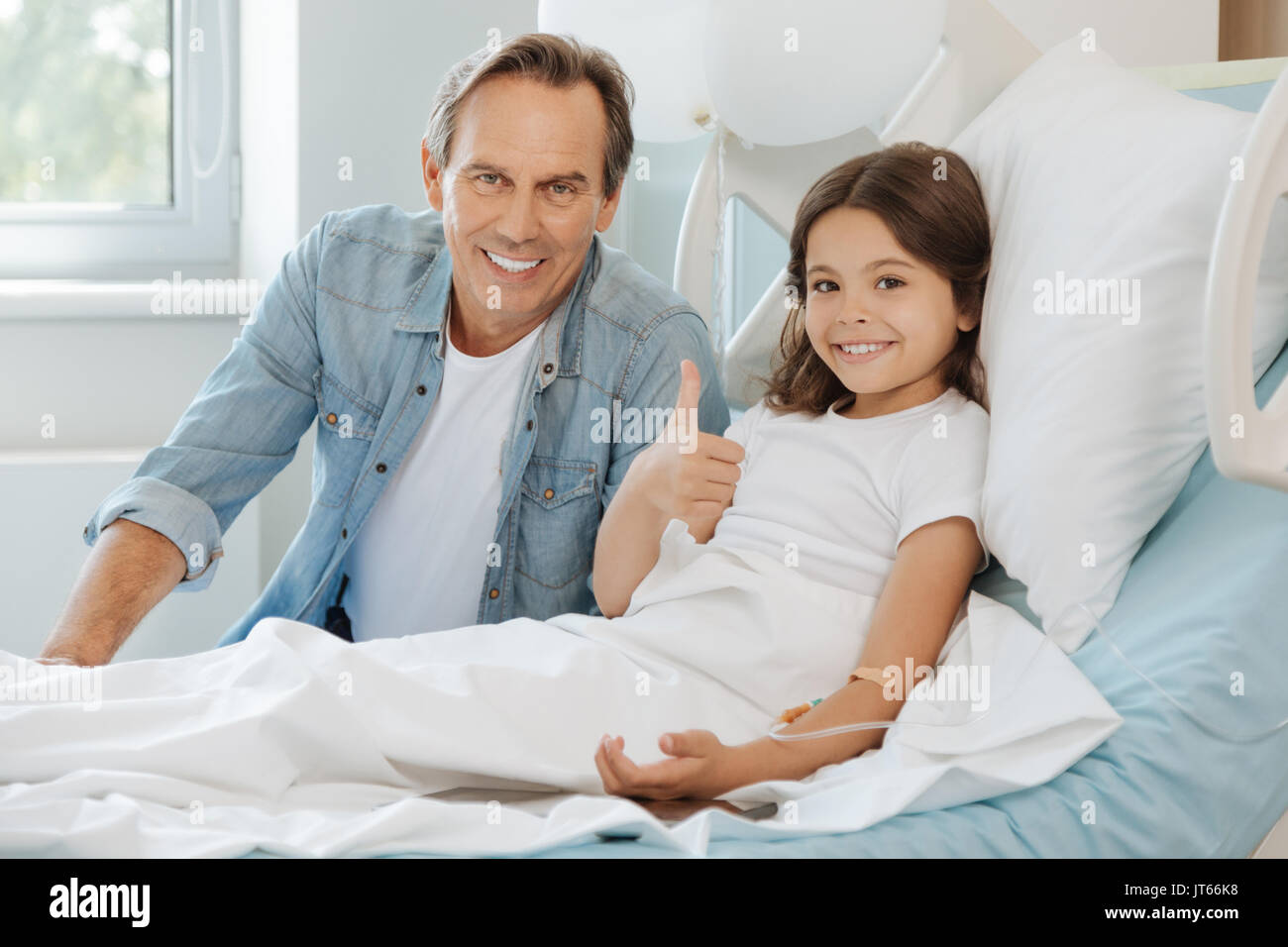 Happy cheerful girl being optimistic Stock Photo - Alamy
