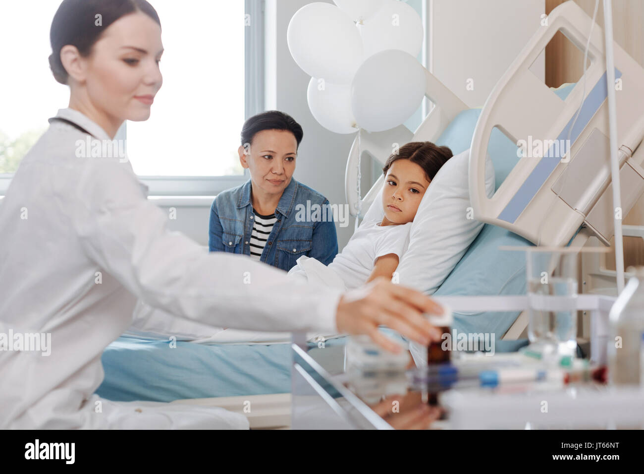 Receiving medical treatment hi-res stock photography and images - Alamy