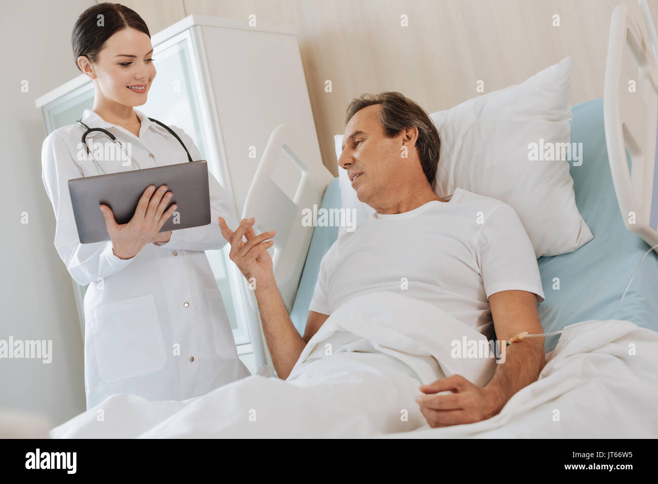 Patient connected to iv hi-res stock photography and images - Alamy
