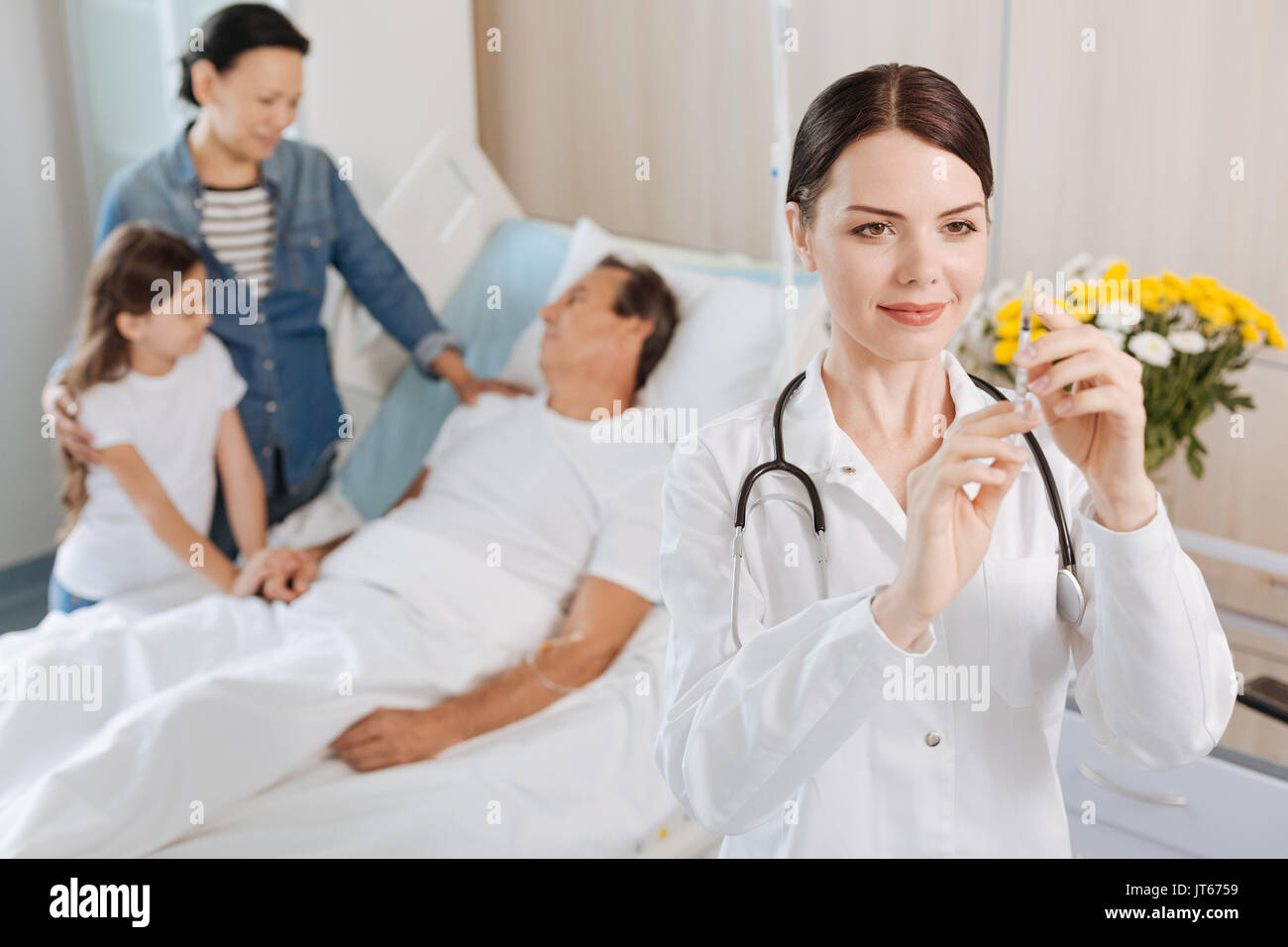 Joyful delighted therapist smiling Stock Photo - Alamy