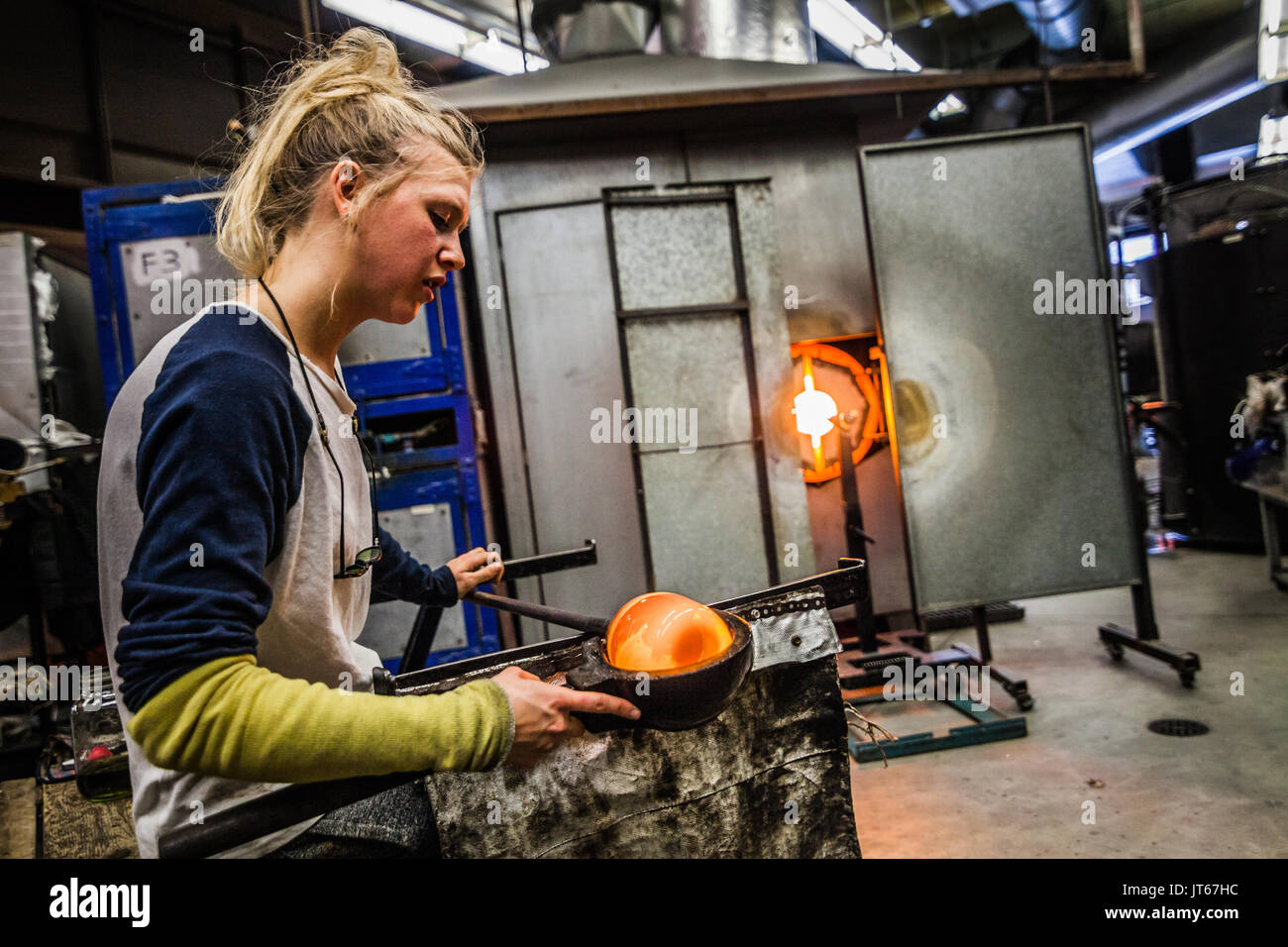 Glass Blowing Workshop - Two Women Shaping glass on the Blowpipe Stock ...