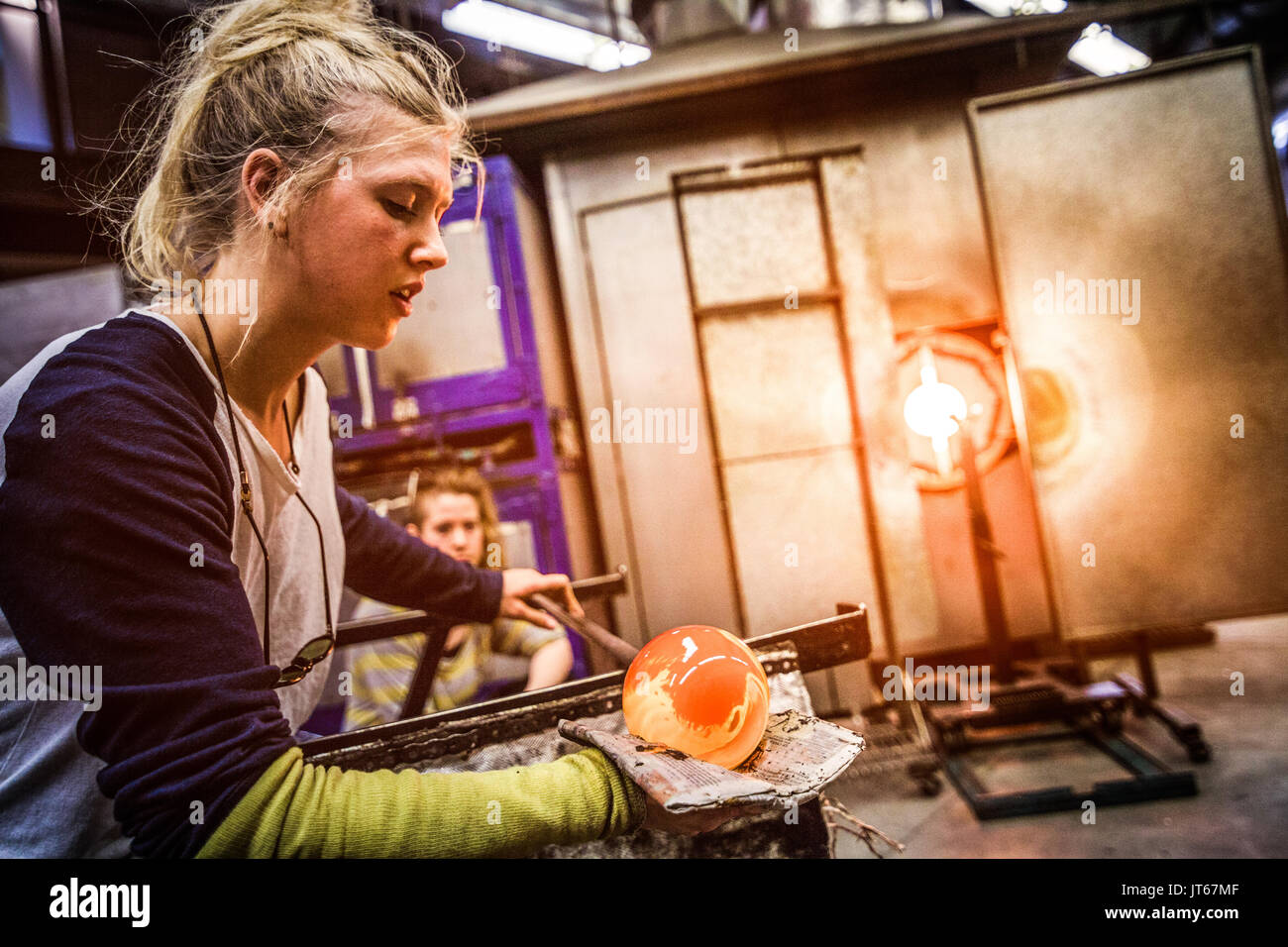 Glass Blowing Workshop - Two Women Shaping glass on the Blowpipe Stock ...