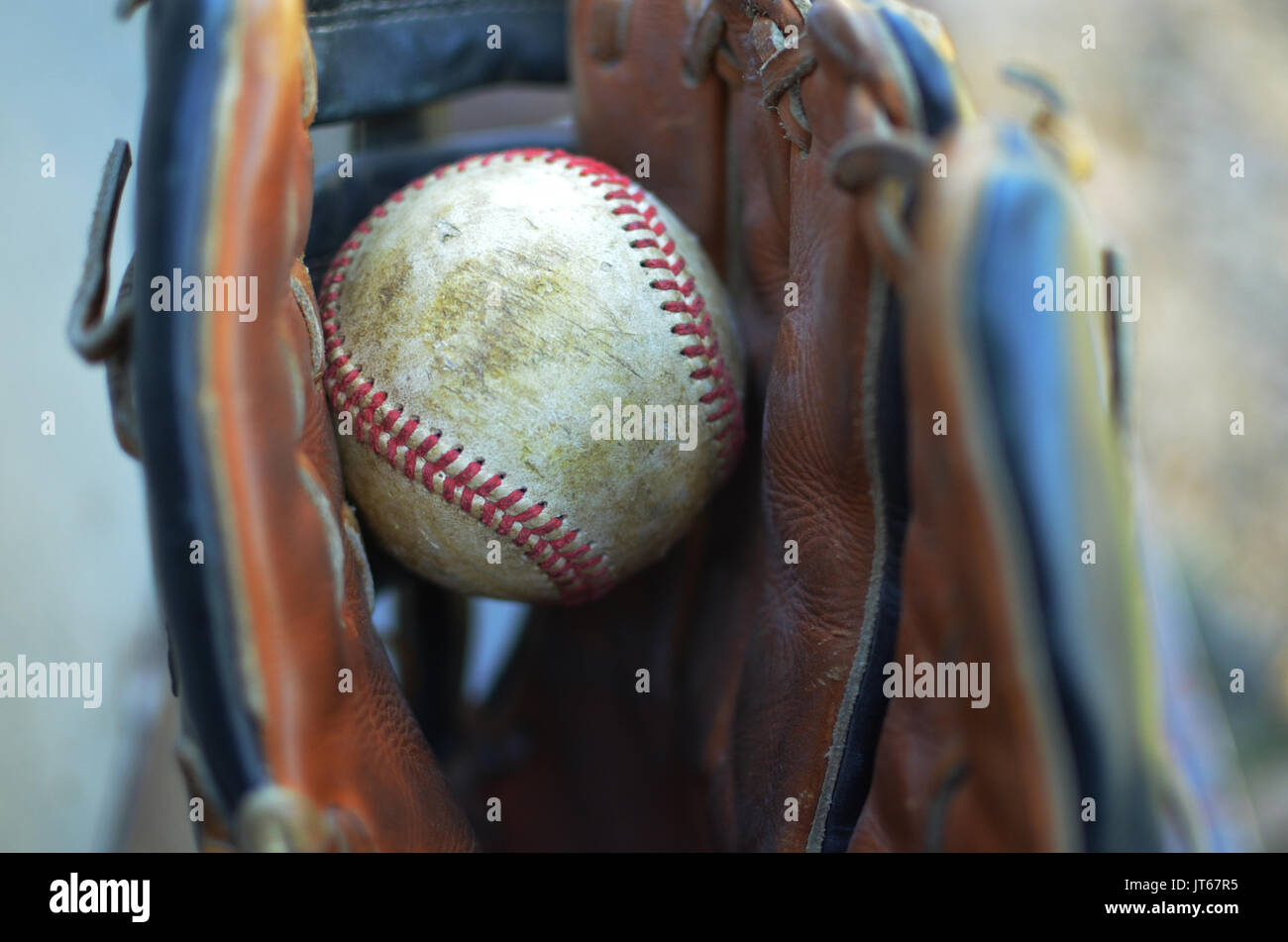Old vintage baseball caught in leather mitt, shows athletic appeal of ...