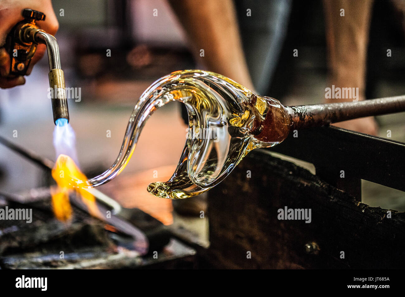 Glassblowing professional working on hi-res stock photography and ...