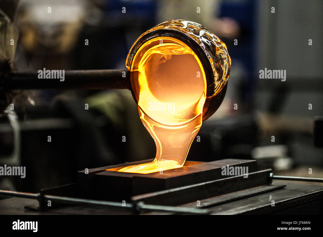Pouring Melted Glass into Graphite Mold in Workshop Stock Photo - Alamy