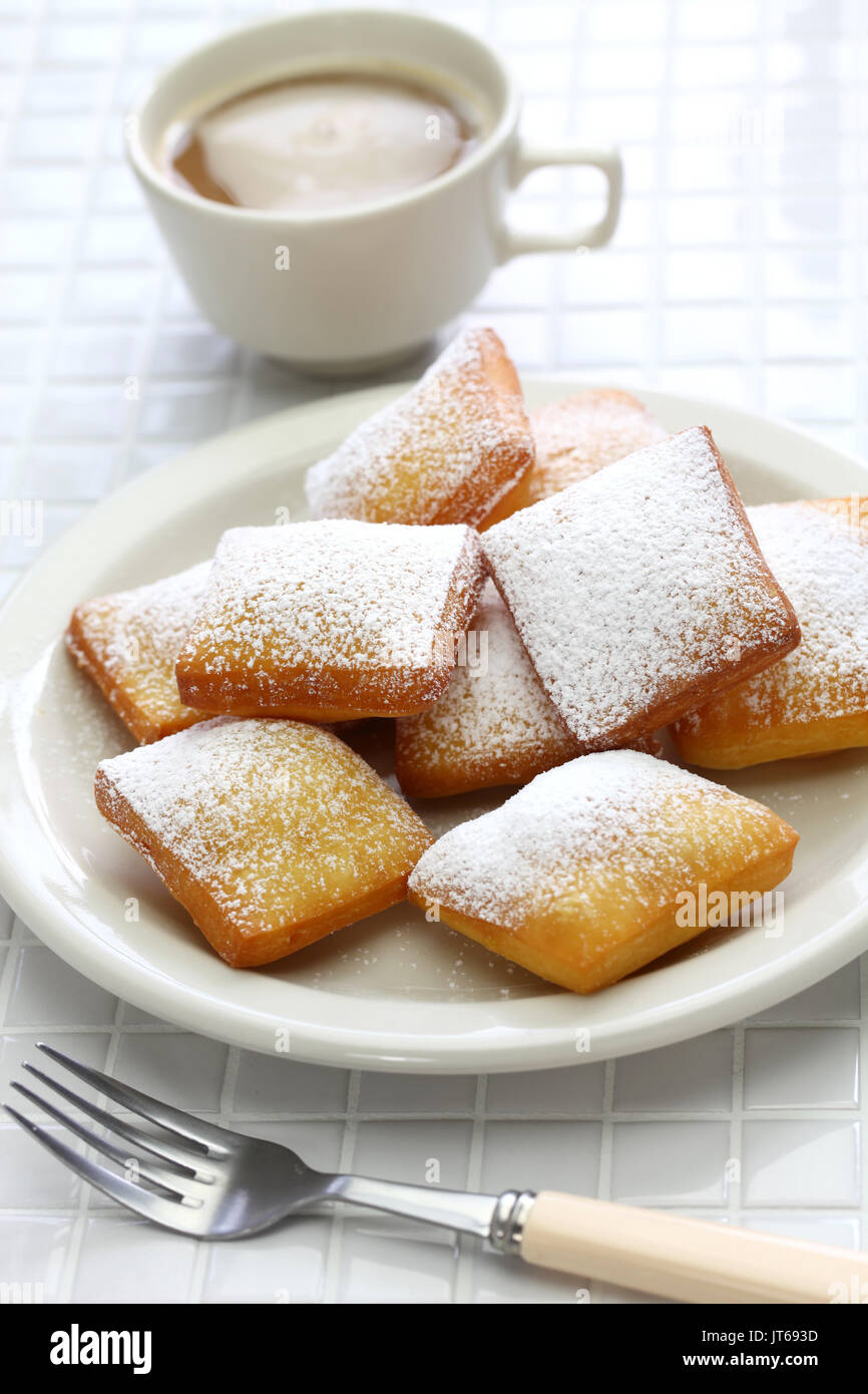 homemade new orleans beignet donuts and a cup of coffee Stock Photo - Alamy