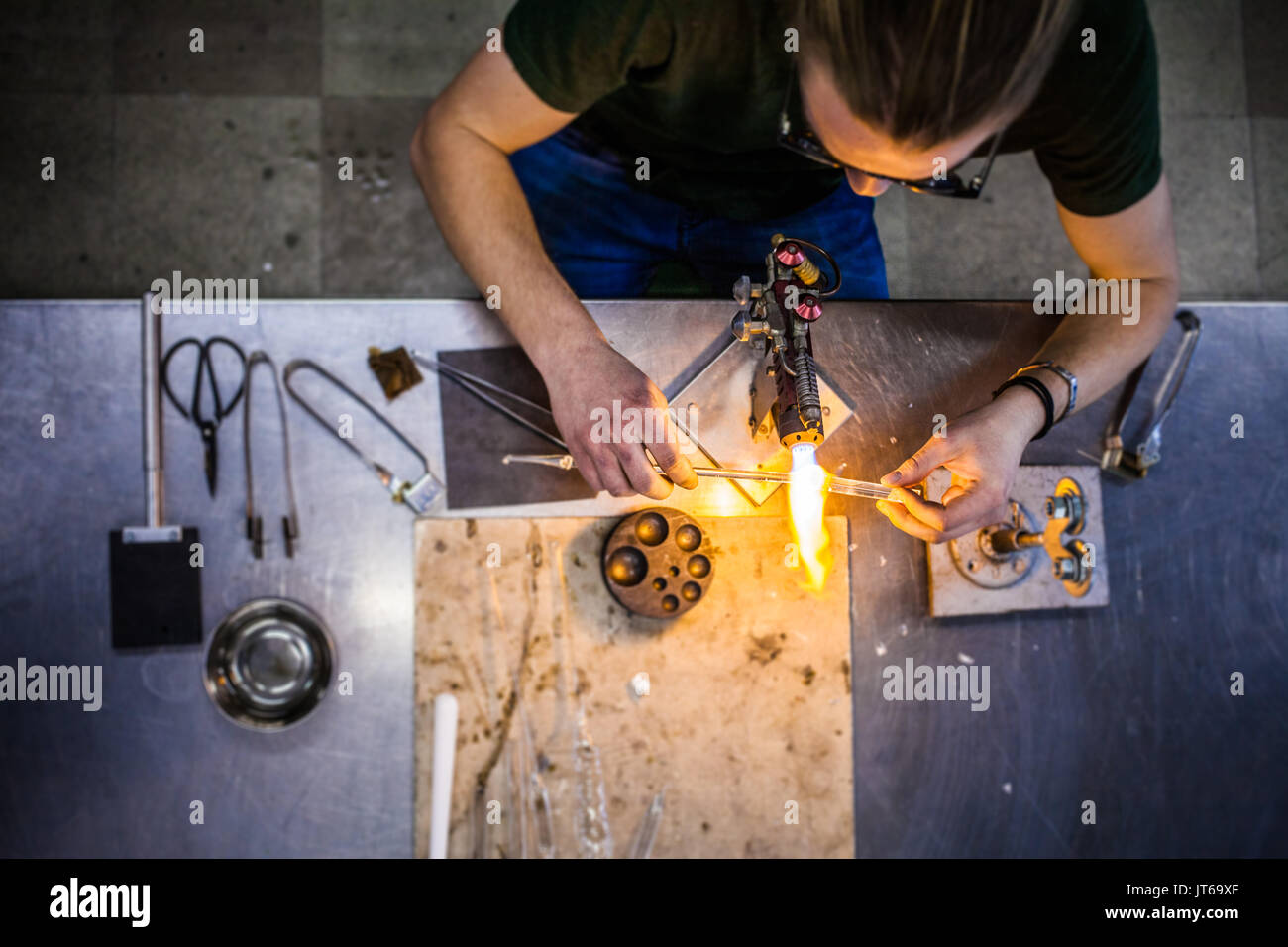 Top View of Glassblowing Professional Working on a Torch Flame with ...