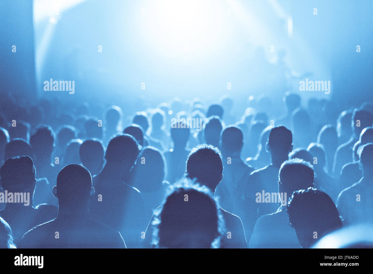Back lit Blue ambiance and and Crowd in silhouette during a Concert ...