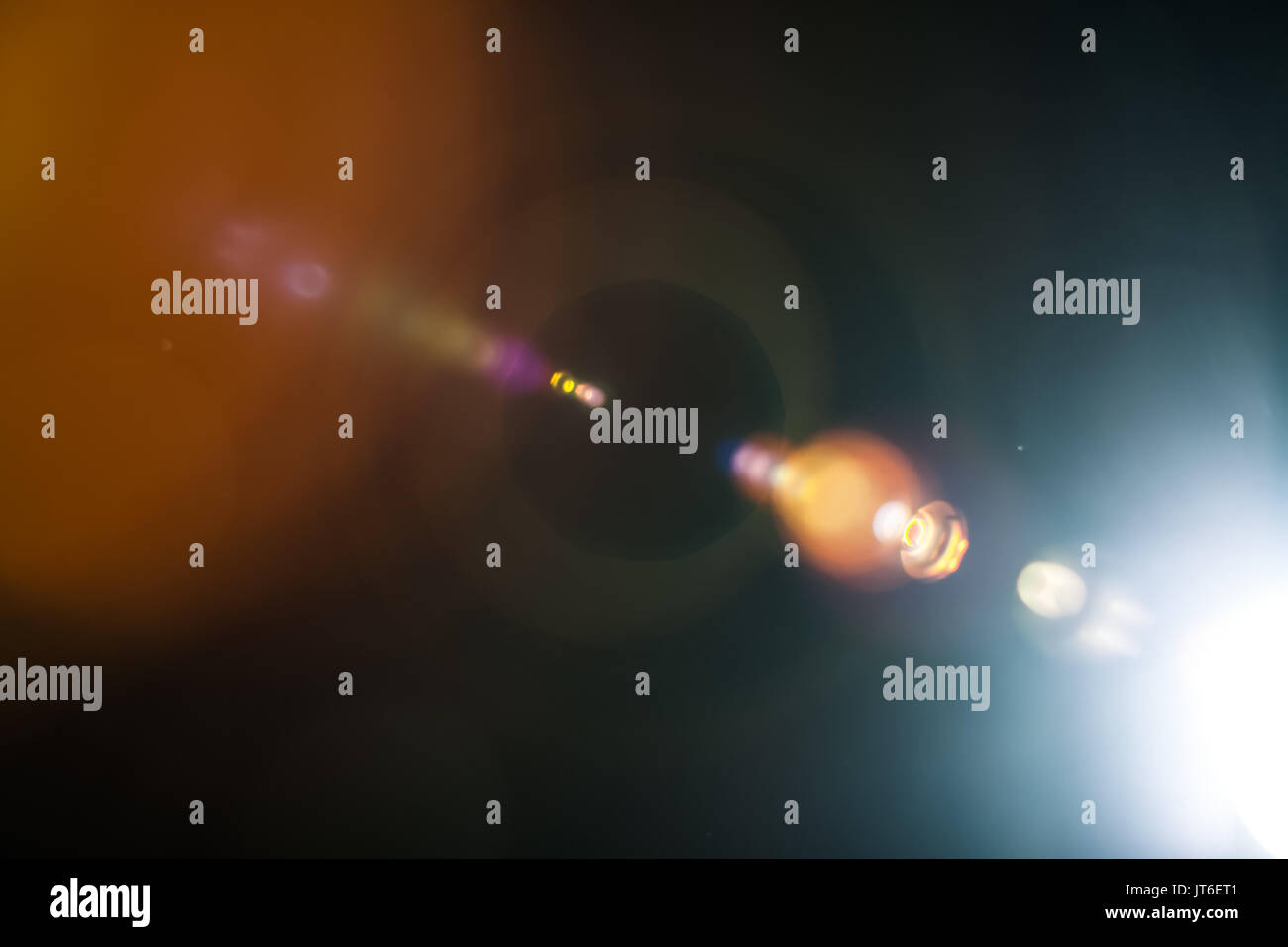 Real Lens Flare Shot in Studio over Black Background. Easy to add as ...