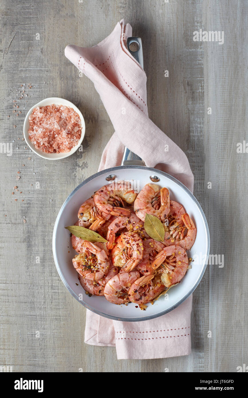 Cooked red shrimp on a light background. Prepared in a frying pan Stock ...