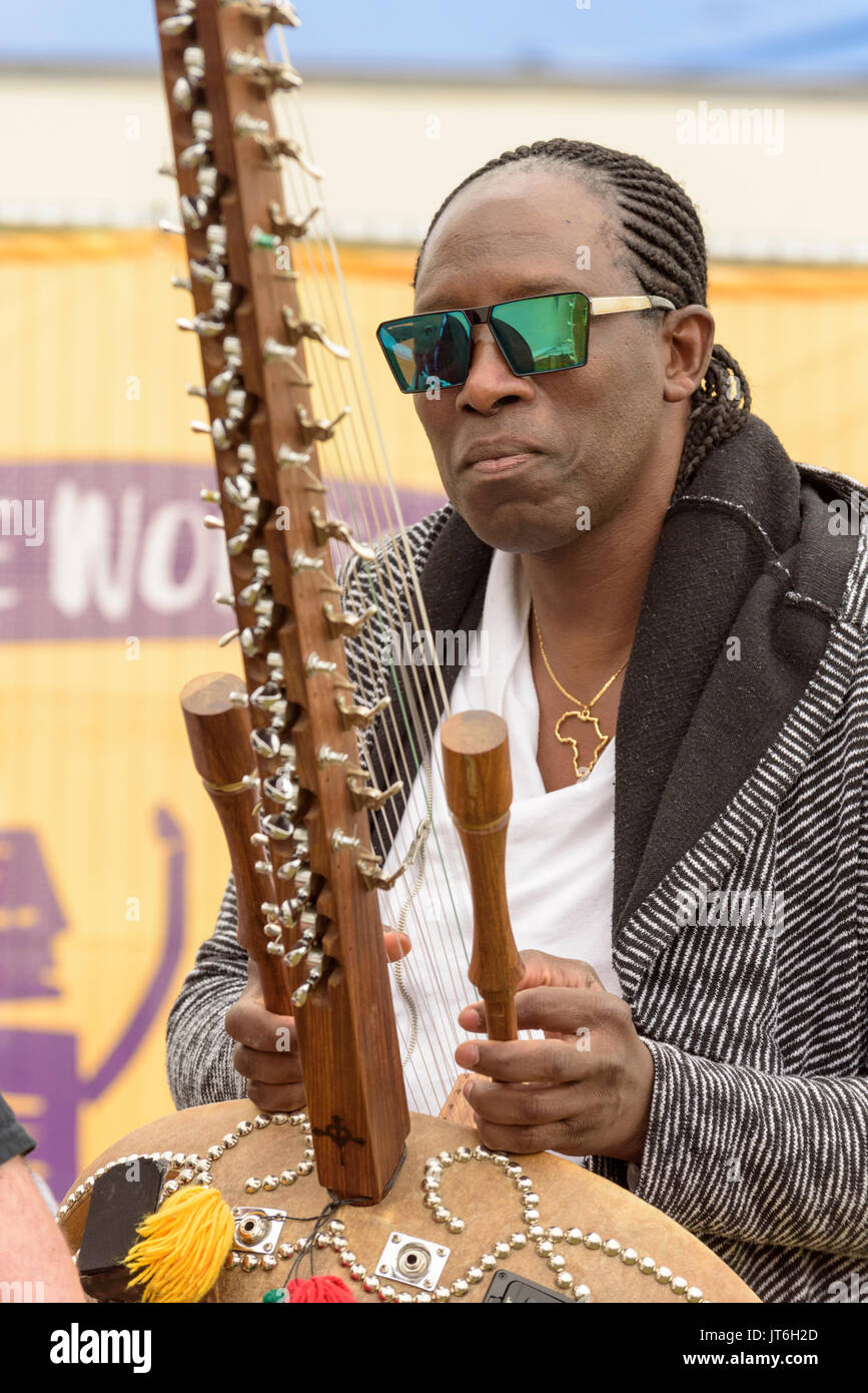 N'Faly Kouyate of the Afro Celt Sound System performing at the WOMAD ...