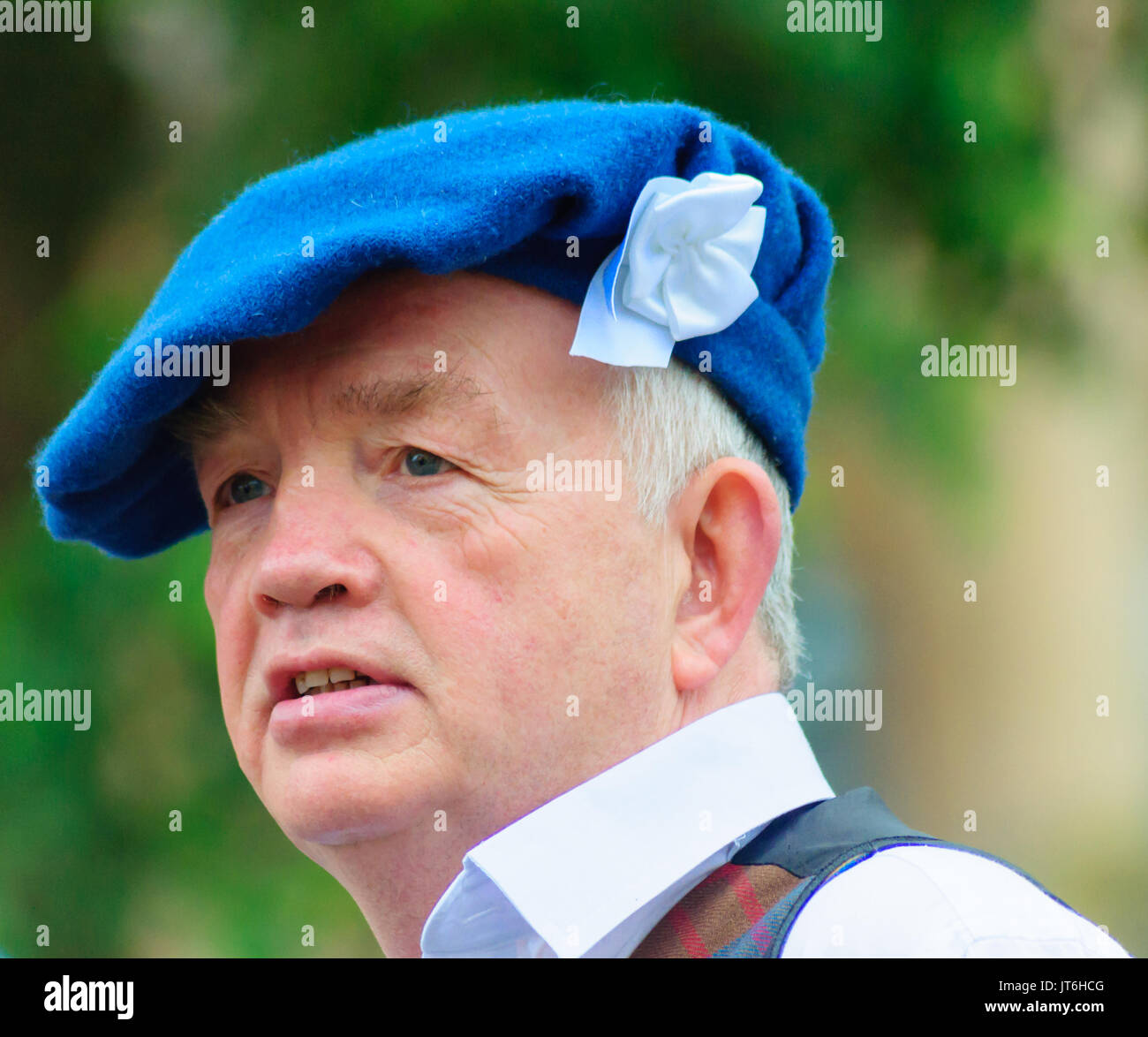 Male wearing a blue cap celebrating Sma Shot Day in the parade ...