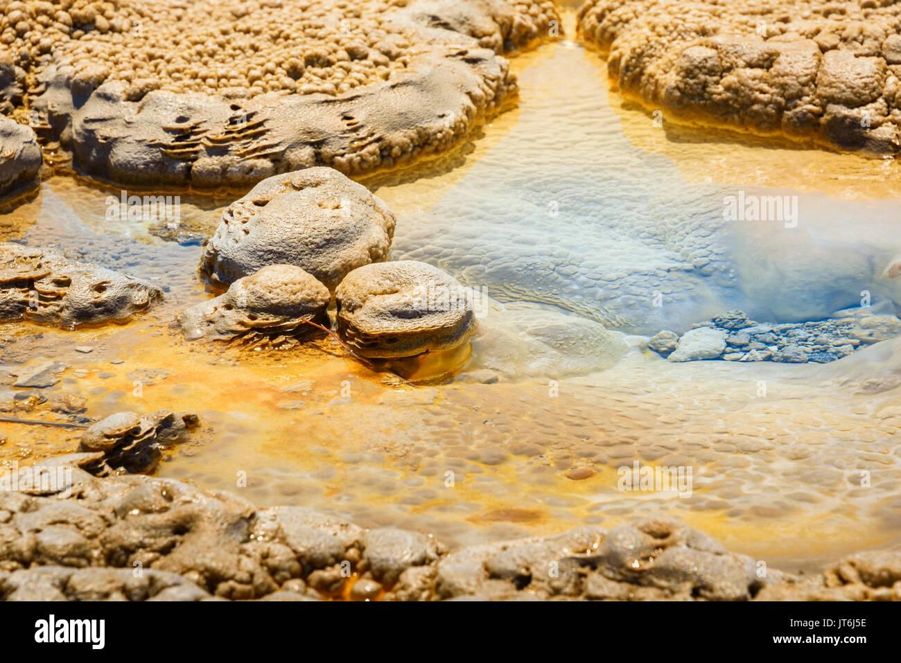 Colorful soil, blue water of hot springs, geysers. Mineral deposits ...