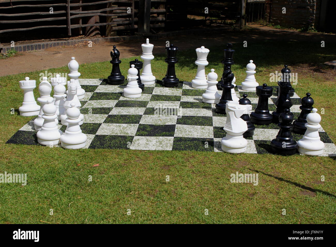 Giant game of chess with board laid out on grass outside Stock Photo ...