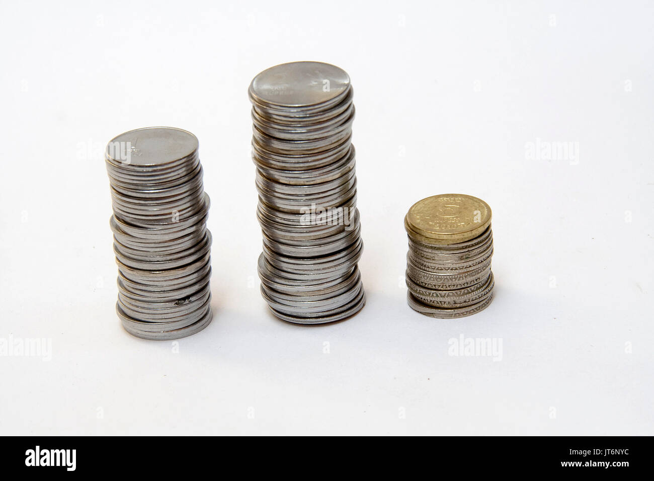 Columns of coins indicating trends in financial market, isolated on ...