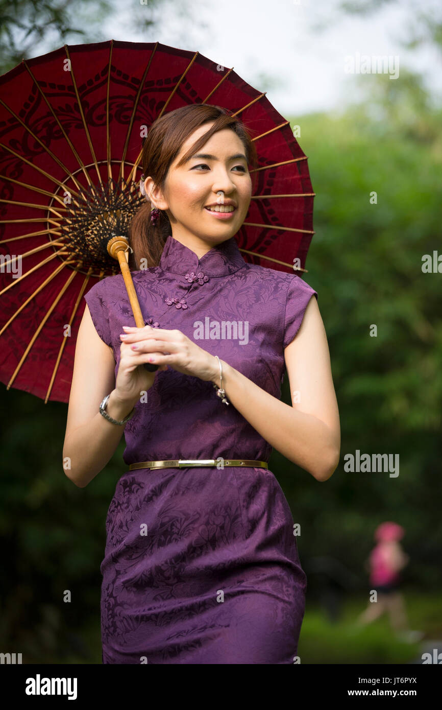 Chinese Woman wearing a Cheongsam Chinese Dress with traditional ...