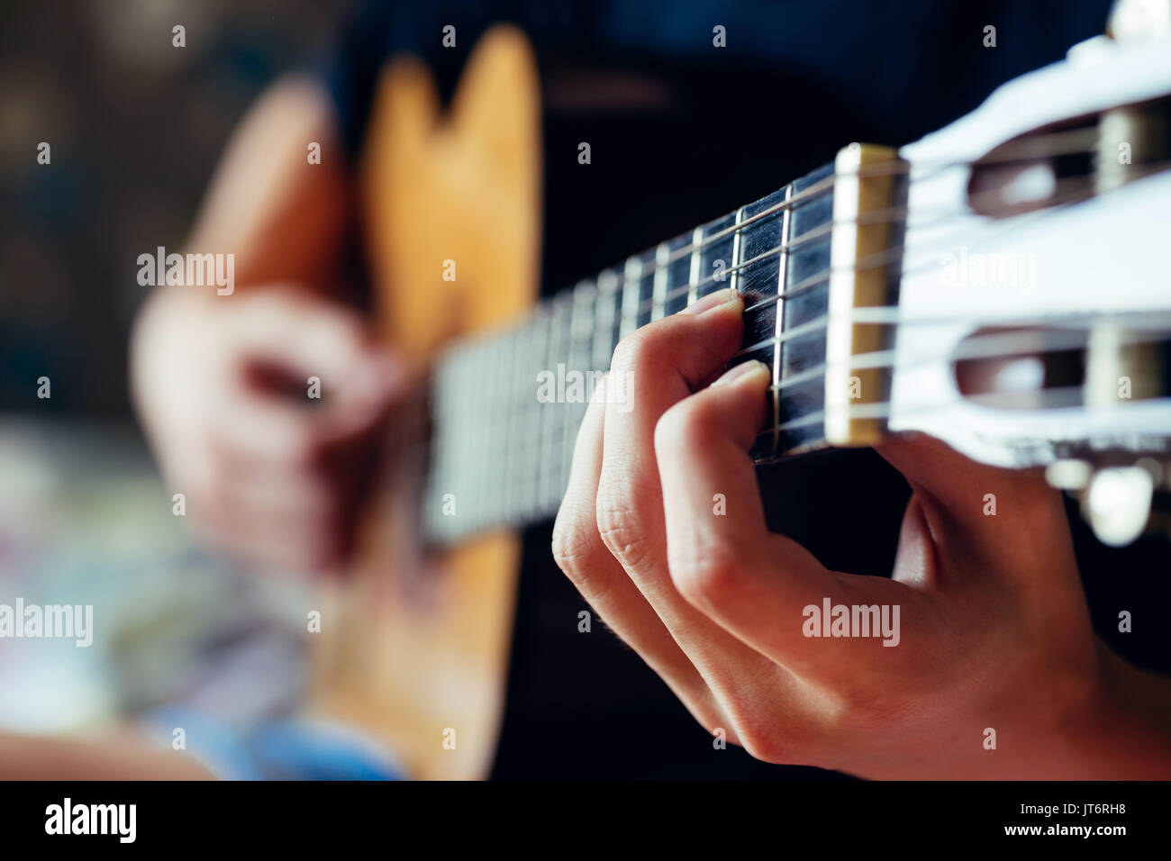 young musician playing acoustic guitar, live music background Stock ...