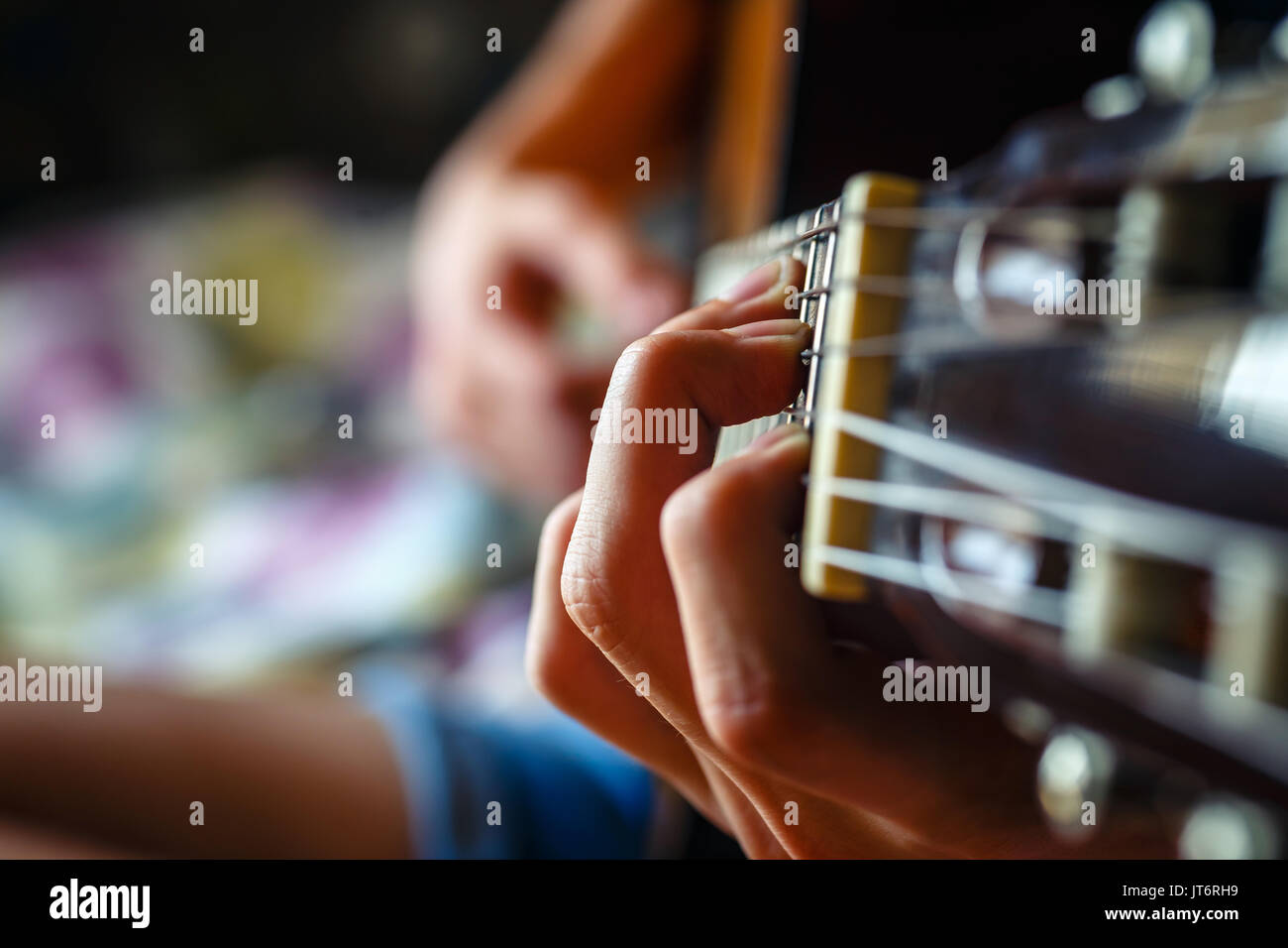 young musician playing acoustic guitar, live music background Stock ...