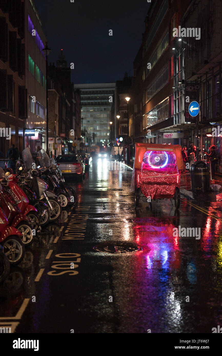 Views of a cycle tuktuk with neon lighting on Dean Street in Soho ...