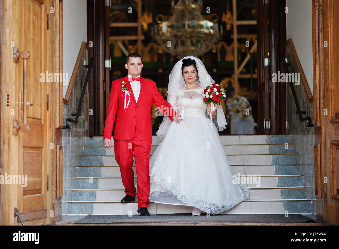 Bride and groom walking out of church hi-res stock photography and ...