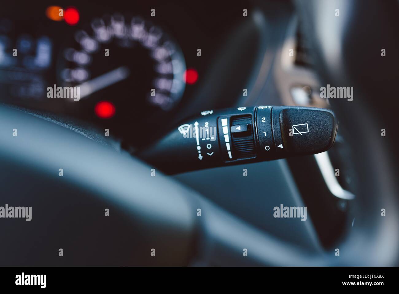 Close up on car rain windscreen wiper control stick. Modern car ...