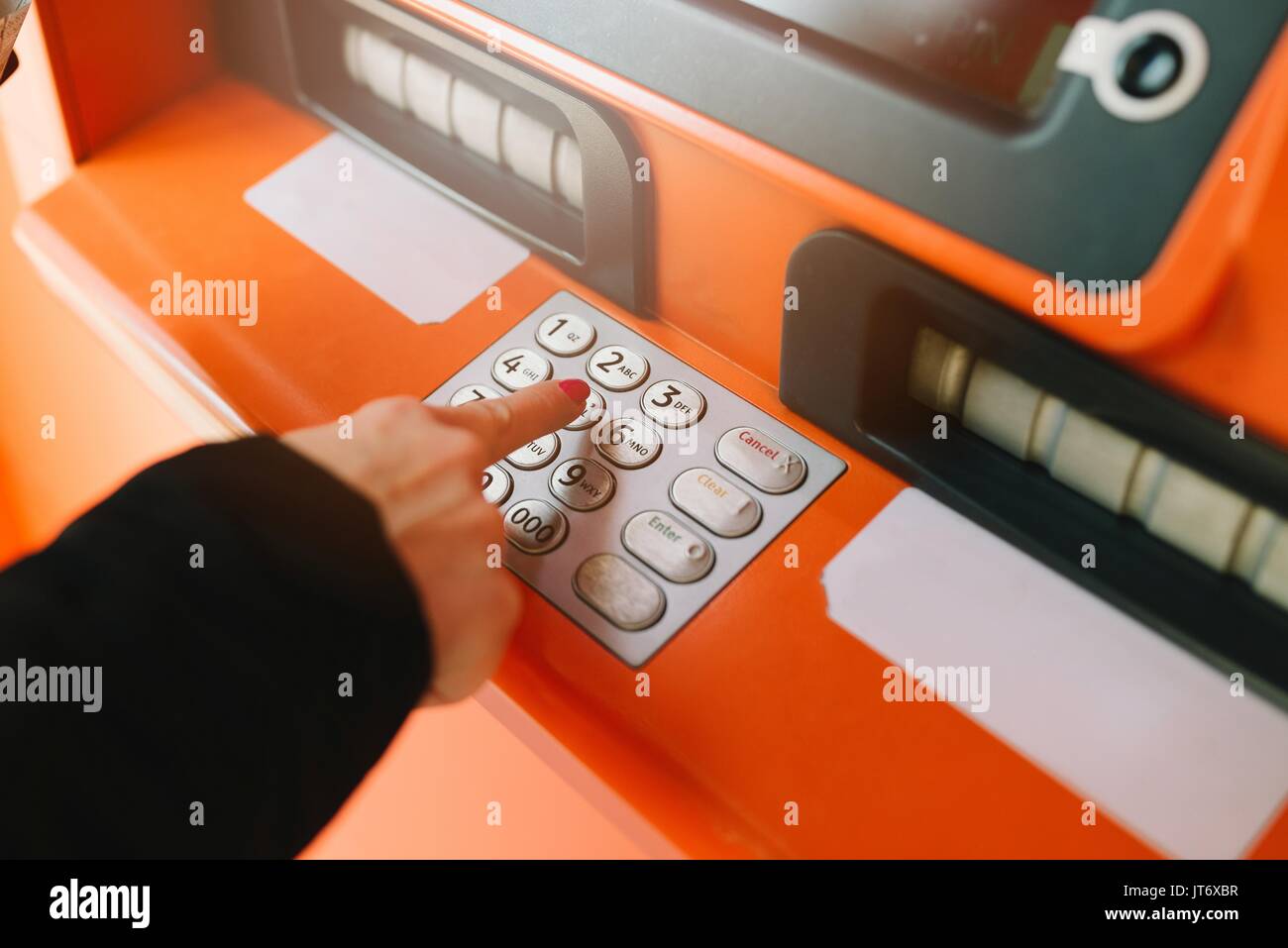 Woman entering pin code on the ATM keypad Stock Photo - Alamy