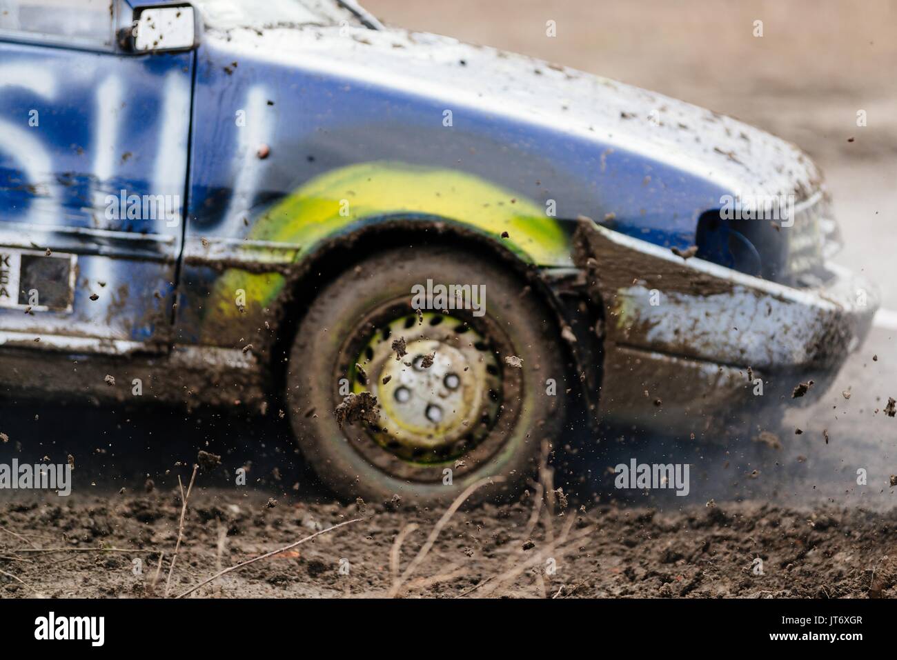 Wreck scrap cars dirt race. Selective focus on splashing mud Stock ...