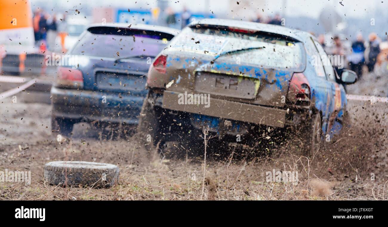 Wreck scrap cars dirt race. Selective focus on splashing mud Stock ...