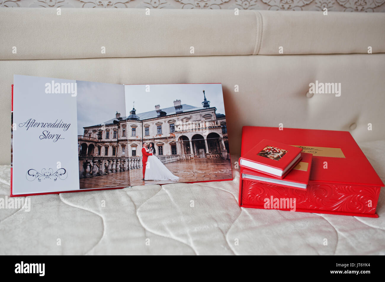 Pages of elegant red wedding photobook or photoalbum on the soft beige ...