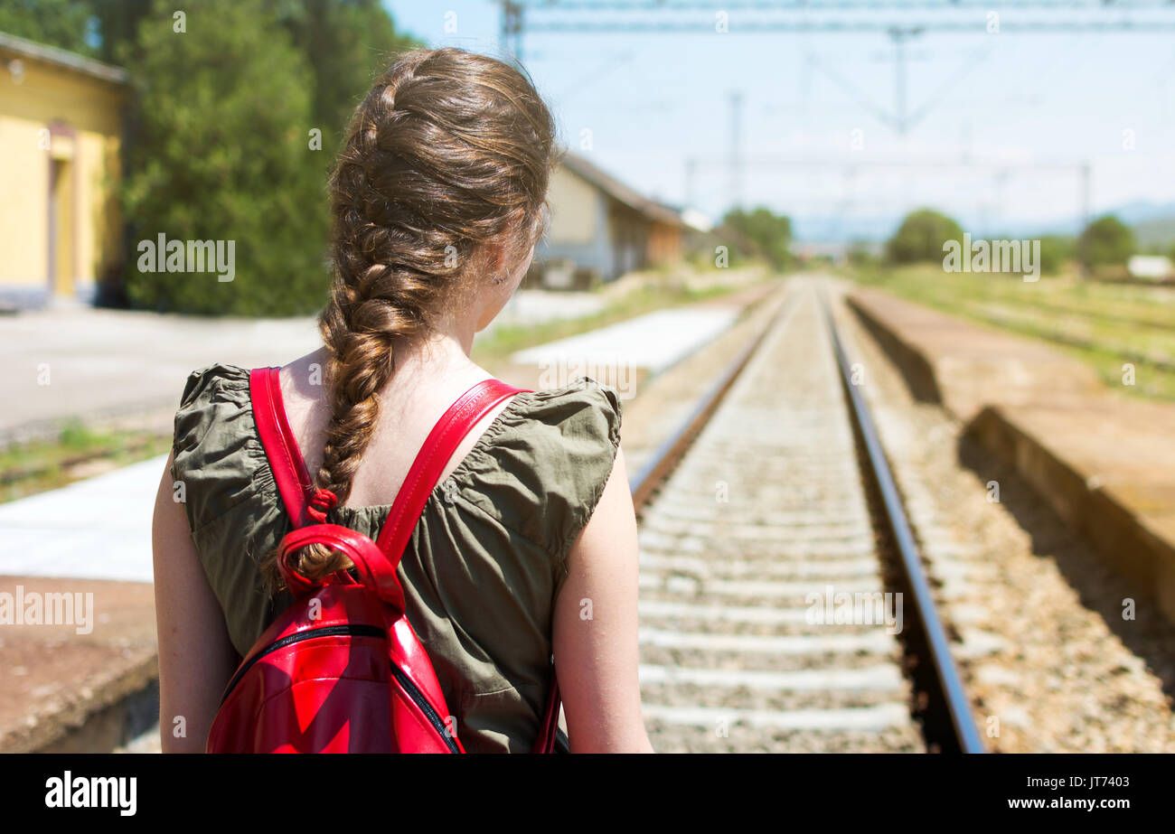 Girl standing on railroad track hi-res stock photography and images - Alamy